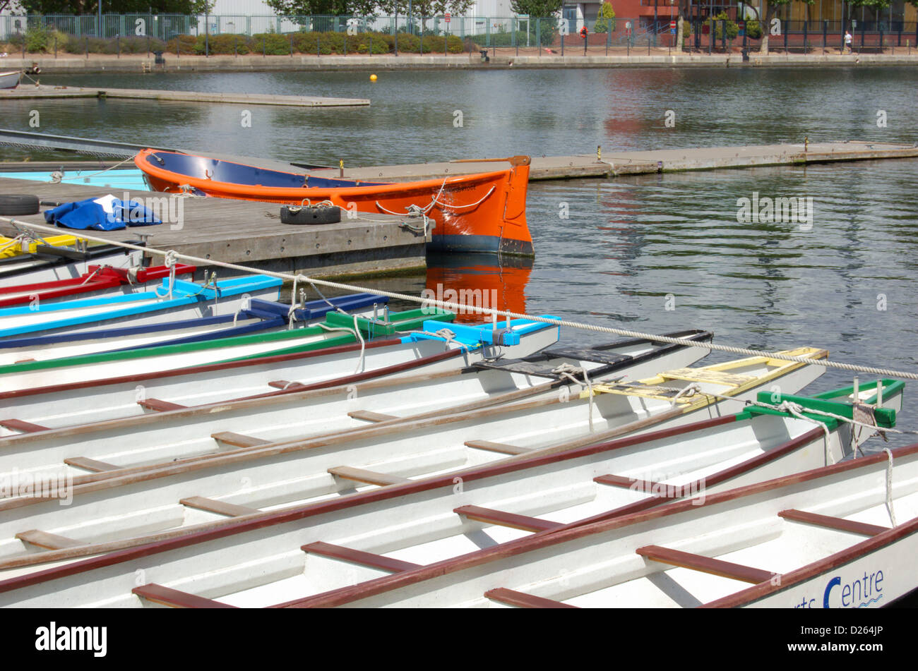 Row of moored rowing boats next to a pontoon Stock Photo - Alamy