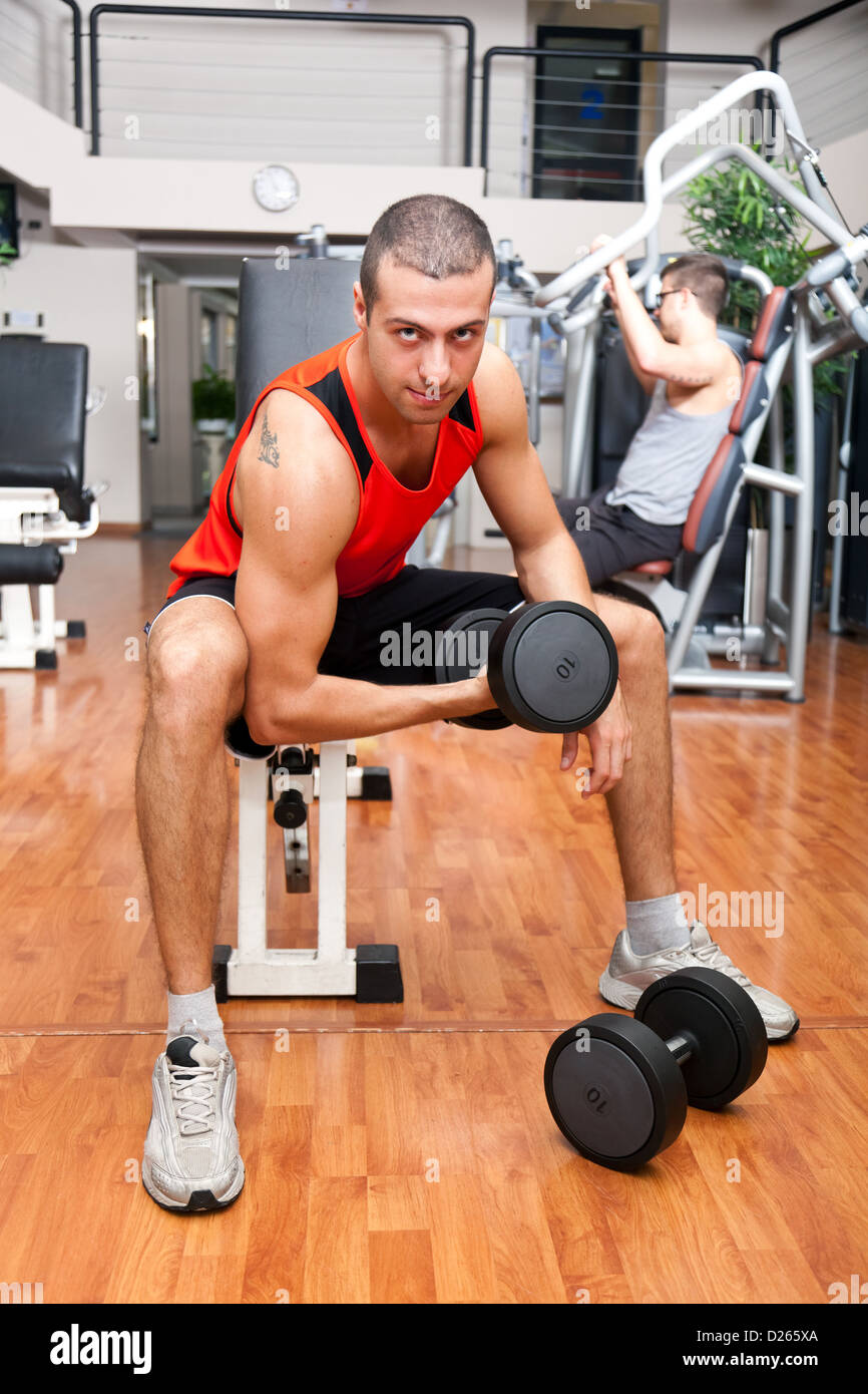 Man doing fitness in a gym Stock Photo - Alamy