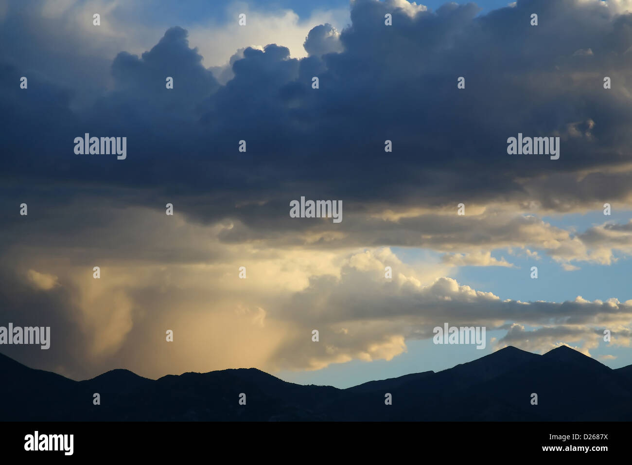 Thundershower over mountains Stock Photo - Alamy