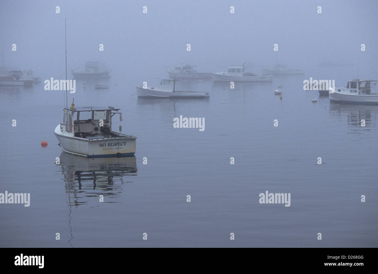 Fishing boats in fog Stock Photo - Alamy