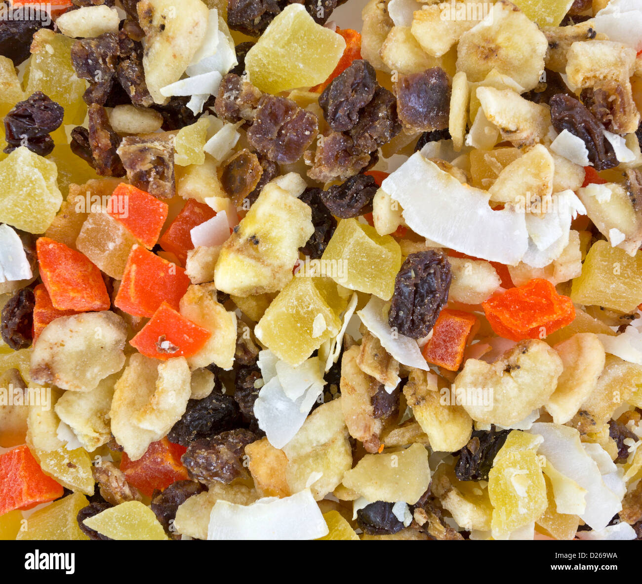 A very close view of a healthy snack mix of coconut, papaya, bananas ...