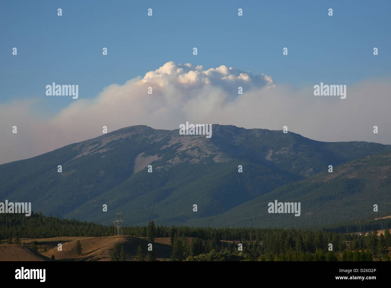 Forest fire smoke over ridgeline Stock Photo - Alamy