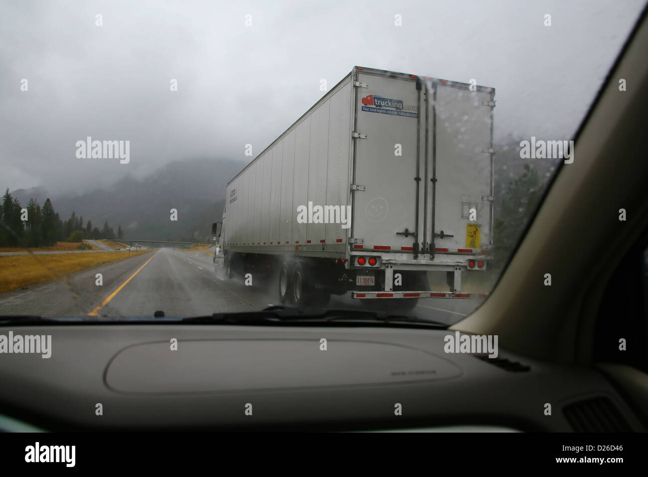 Car passes semi on rainy interstate hi-res stock photography and images ...