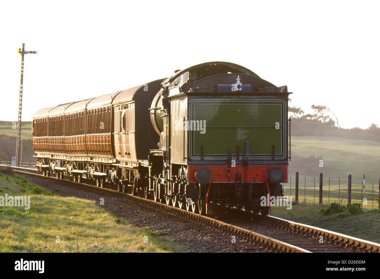 Steam locomotive pulling a passenger train on the North Norfolk Railway ...