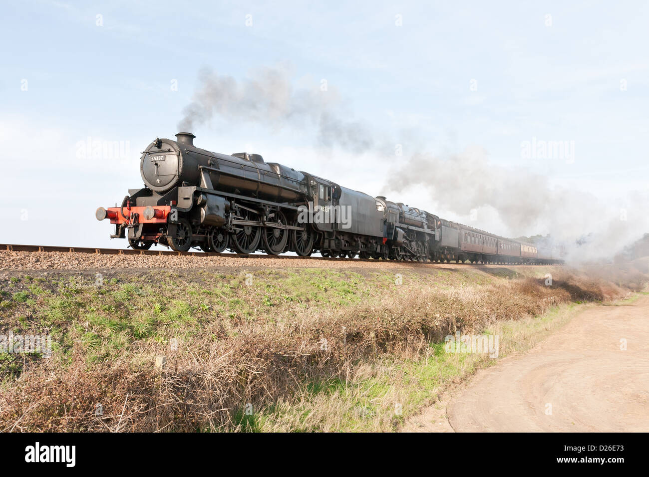 Steam locomotive pulling a passenger train on the North Norfolk Railway ...