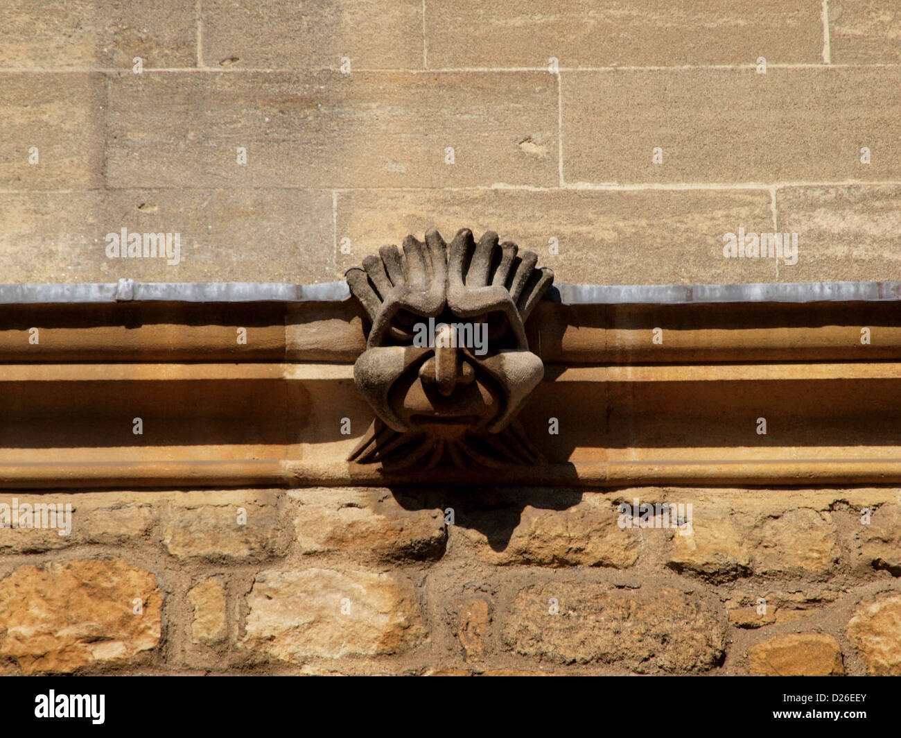 A Gargoyle on the wall of an Oxford University college Stock Photo - Alamy