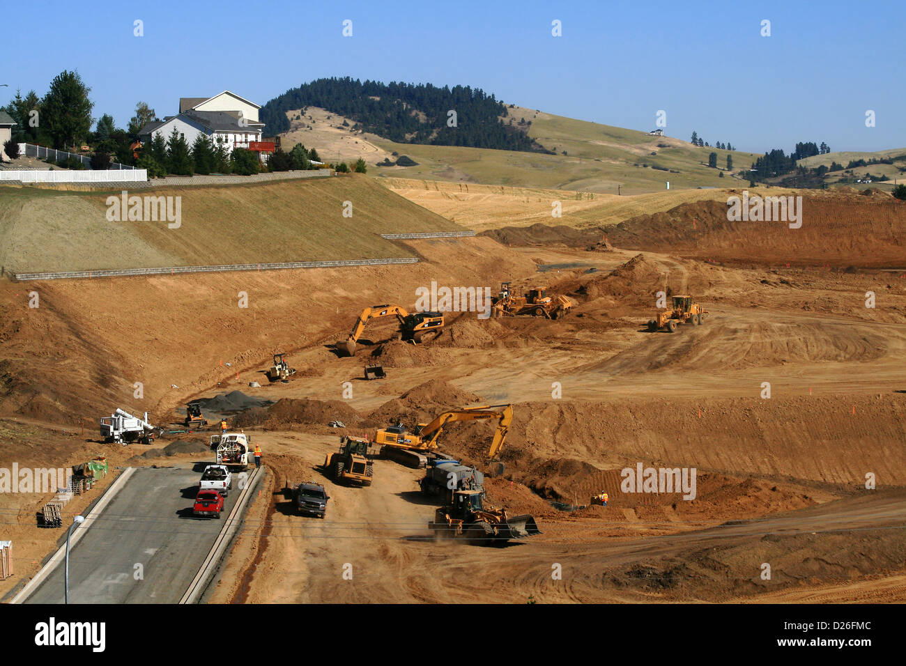 Earth moving at construction site Stock Photo - Alamy