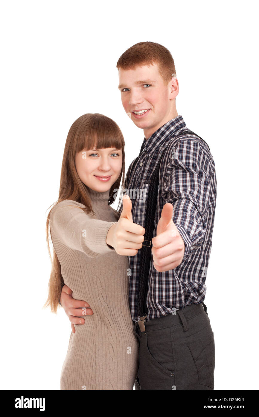 Happy couple gesturing thumbs up sign Stock Photo - Alamy