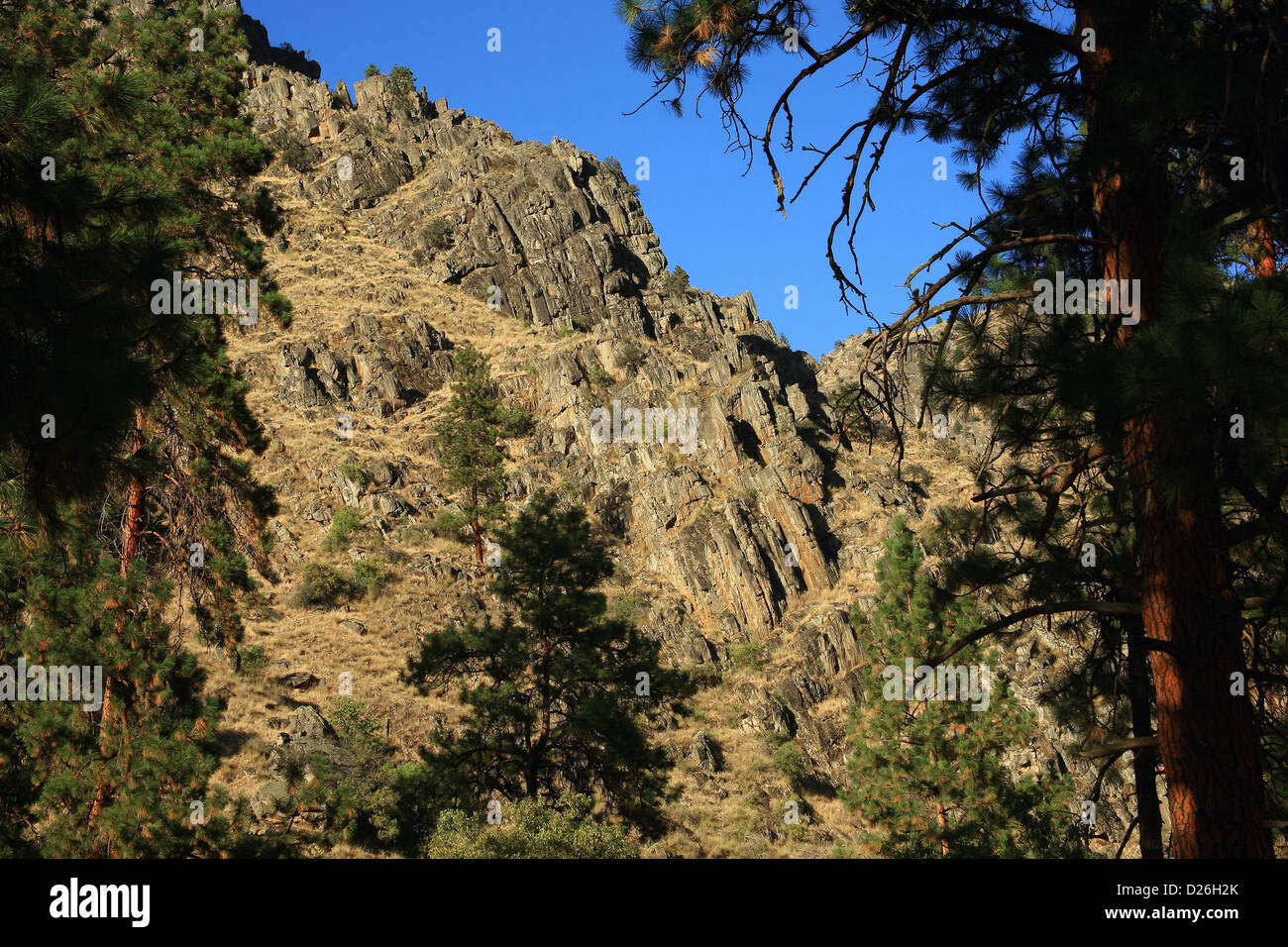 Steep rocky mountain cliffs Stock Photo - Alamy