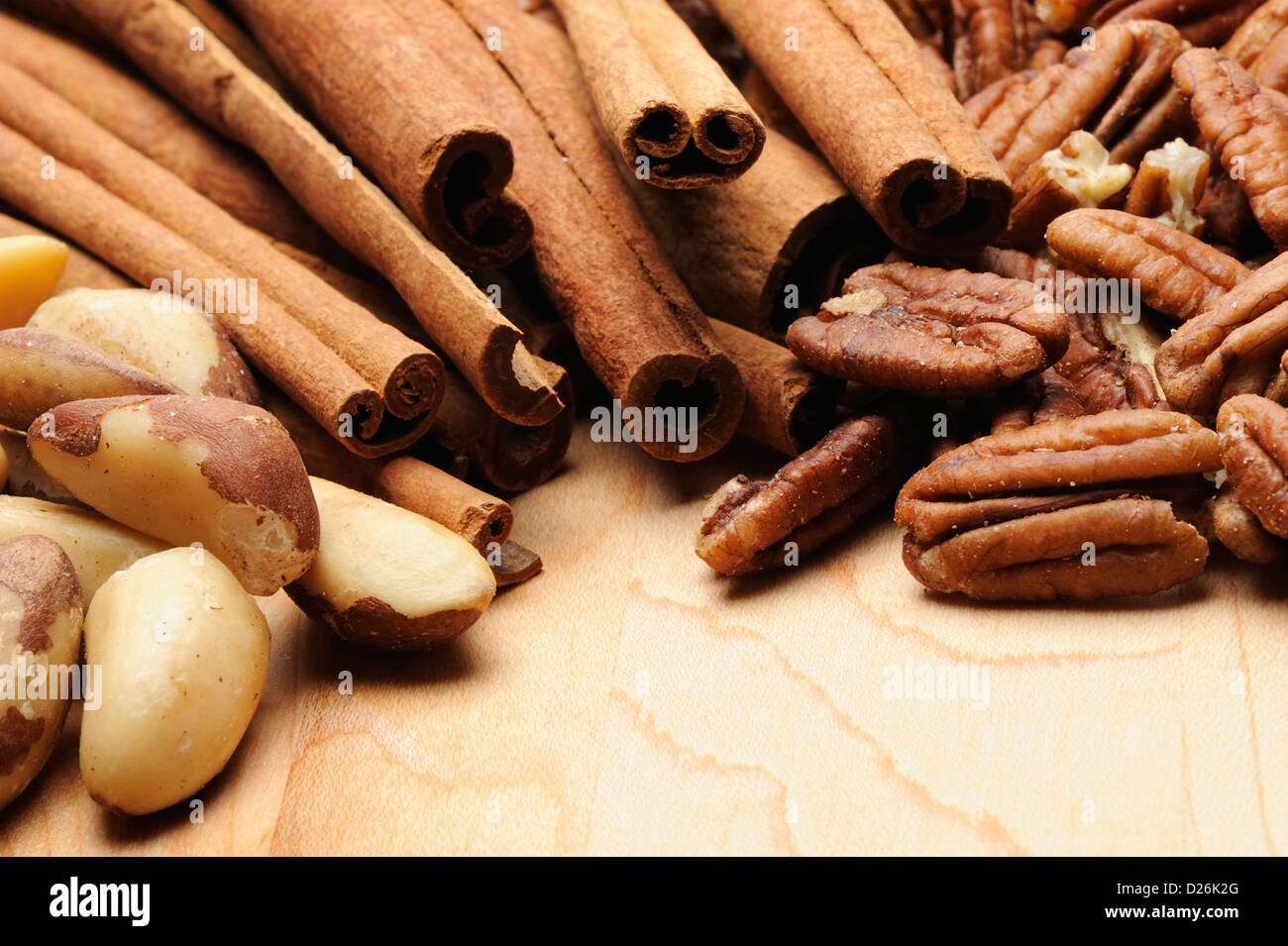 Natural food, pecans, brazil nuts and cinnamon sticks Stock Photo - Alamy