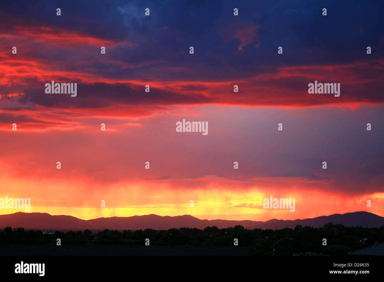 Fiery sunset through storm clouds hi-res stock photography and images ...