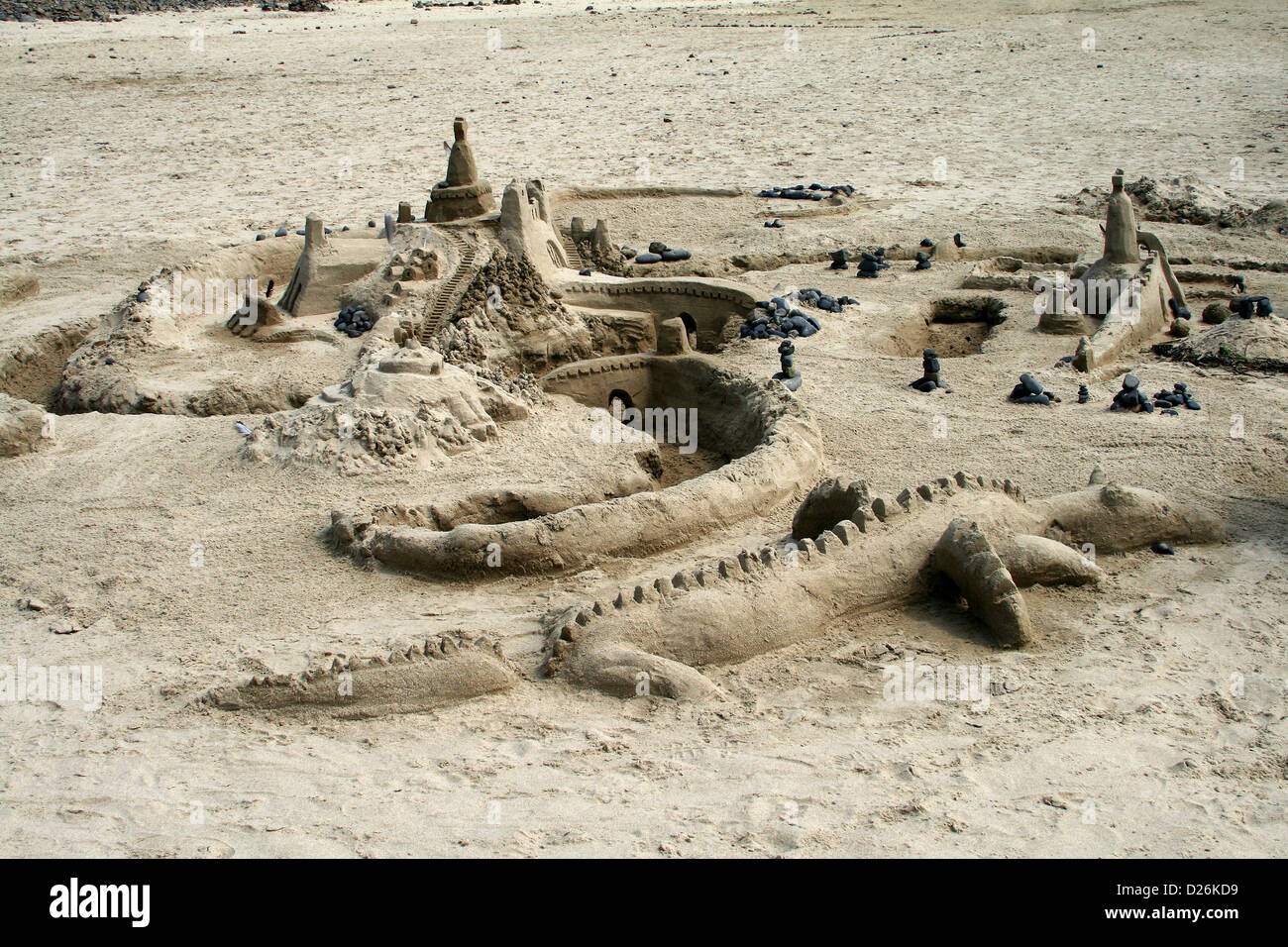 Dragon sand castle on beach Stock Photo - Alamy