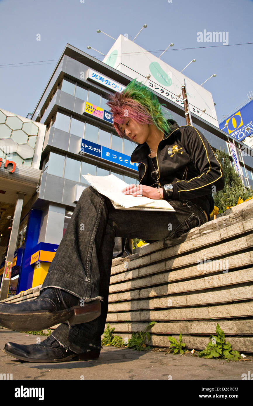 Japanese male punk rocker sitting outside Himeji Station in Himeji ...