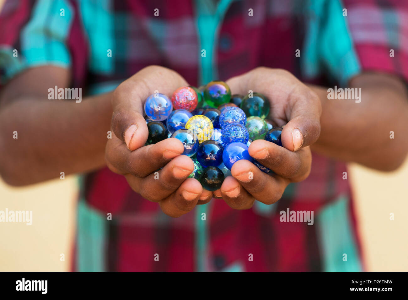 Hand holding marbles hi-res stock photography and images - Alamy
