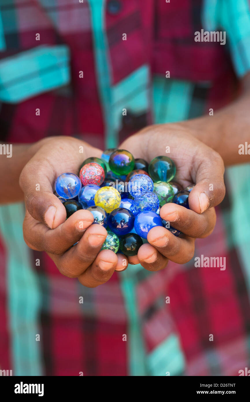Indian boys hands holding marbles. India Stock Photo - Alamy