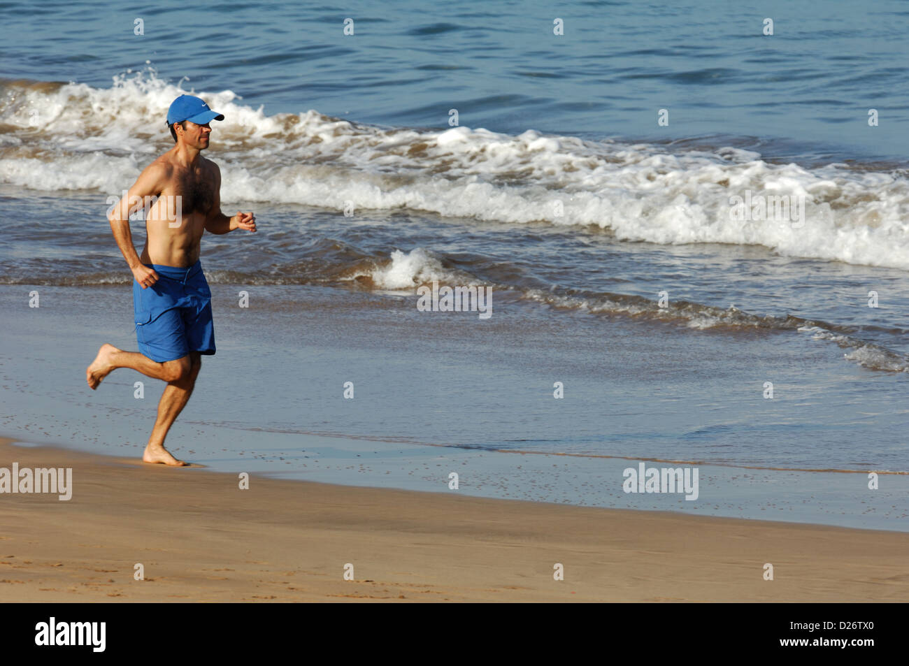 Man jogging on the beach at Maui Hawaii Stock Photo - Alamy