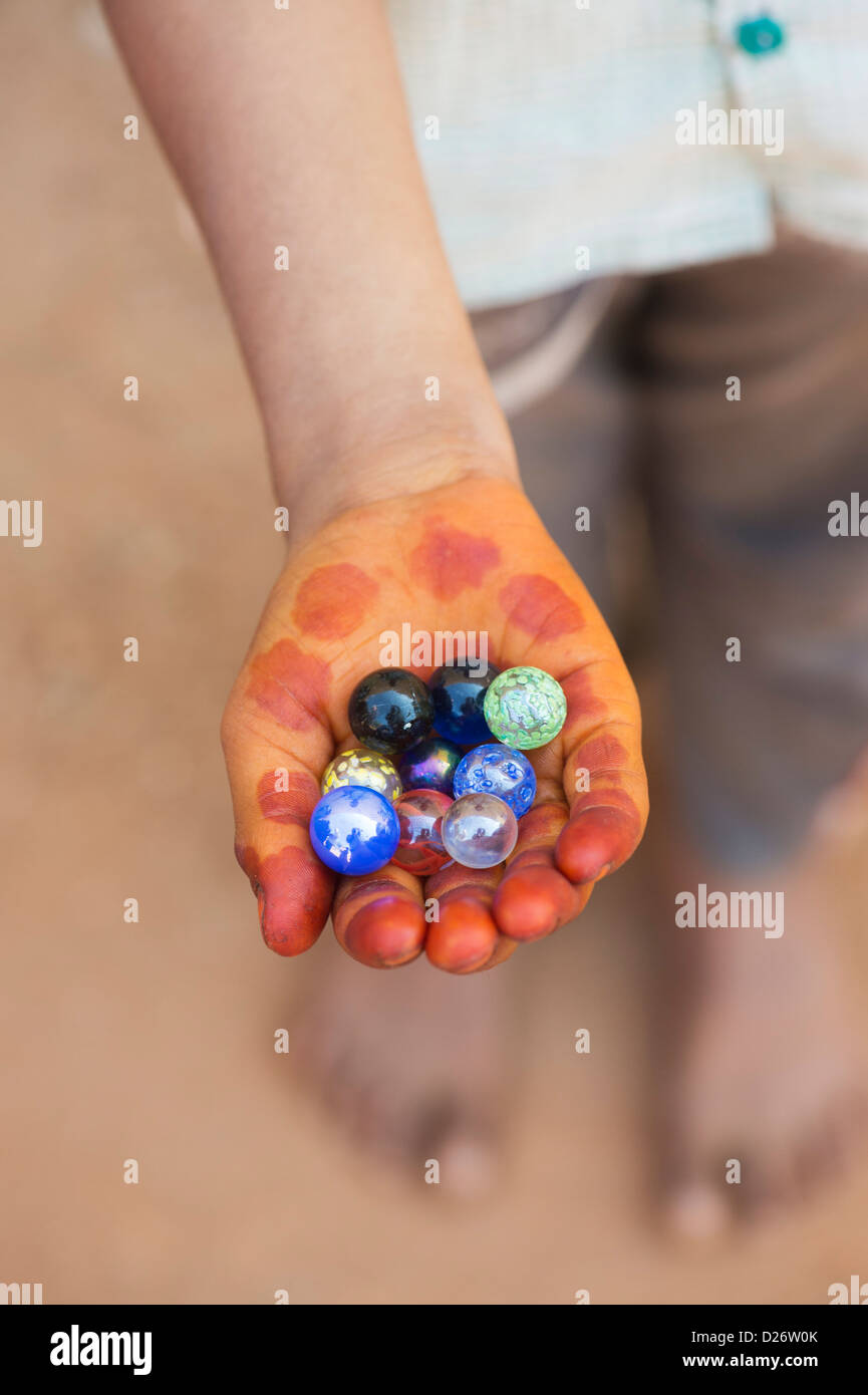 Hand holding marbles hi-res stock photography and images - Alamy