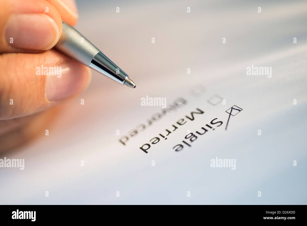 Close-up of hand filling out form Stock Photo - Alamy