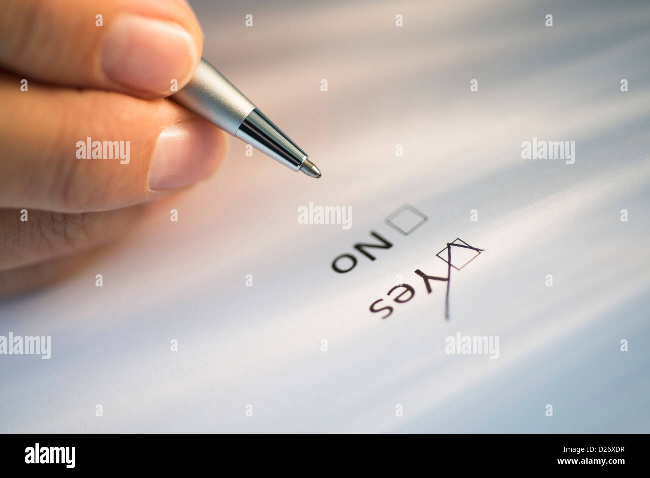 Close-up of hand filling out form Stock Photo - Alamy