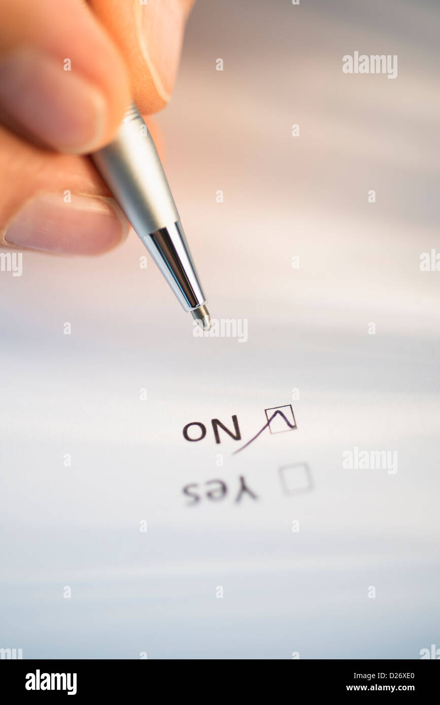 Close-up of hand filling out form Stock Photo - Alamy