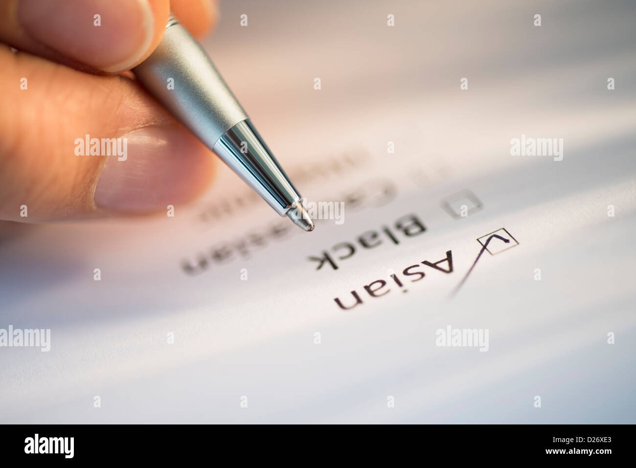 Close-up of hand filling out form Stock Photo - Alamy
