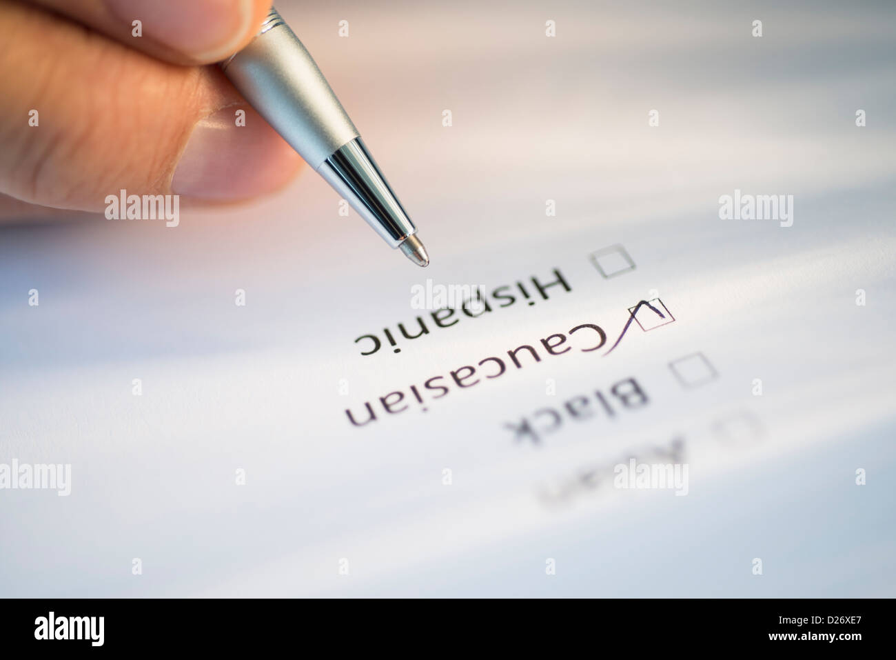 Close-up of hand filling out form Stock Photo - Alamy