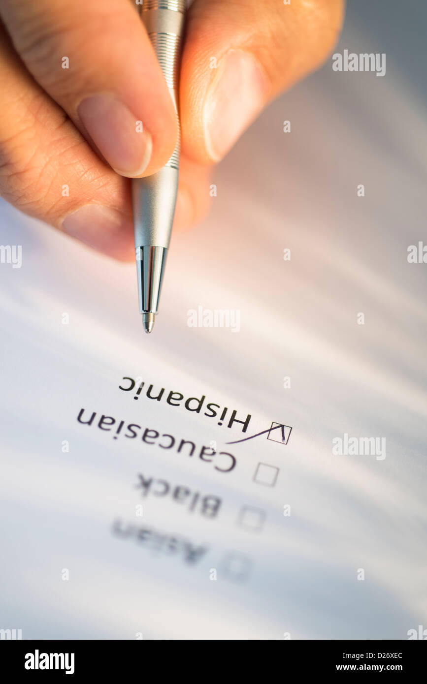 Close-up of hand filling out form Stock Photo - Alamy