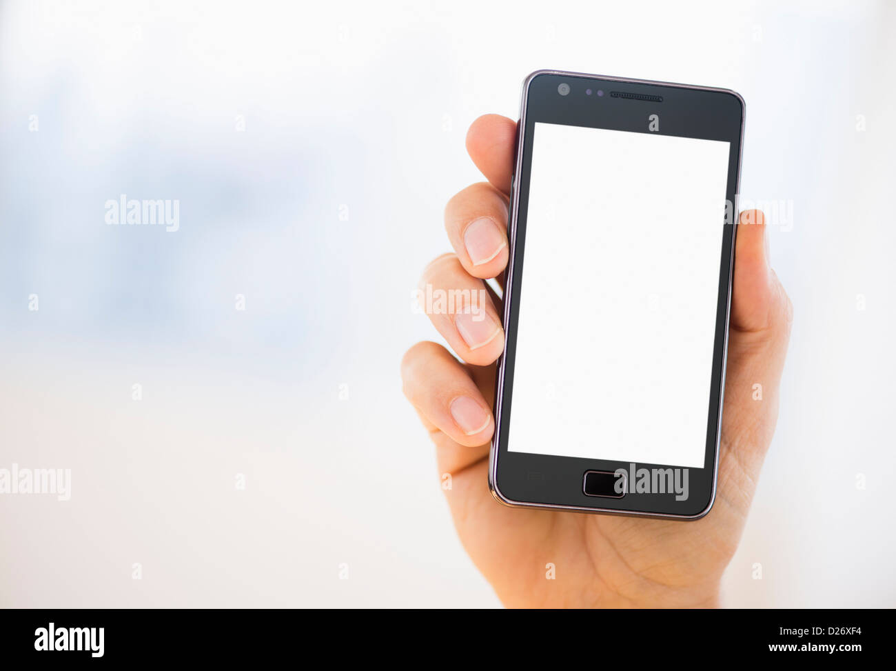 Hand holding smartphone Stock Photo - Alamy