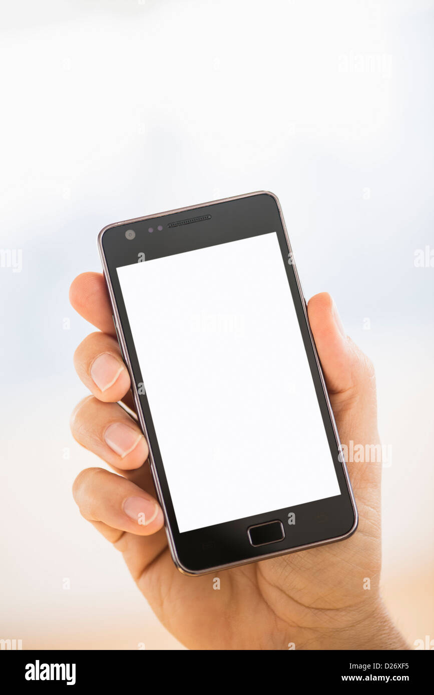 Hand holding smartphone Stock Photo - Alamy