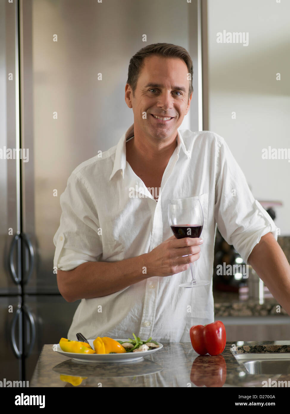 Portrait of mature man with wine glass Stock Photo - Alamy