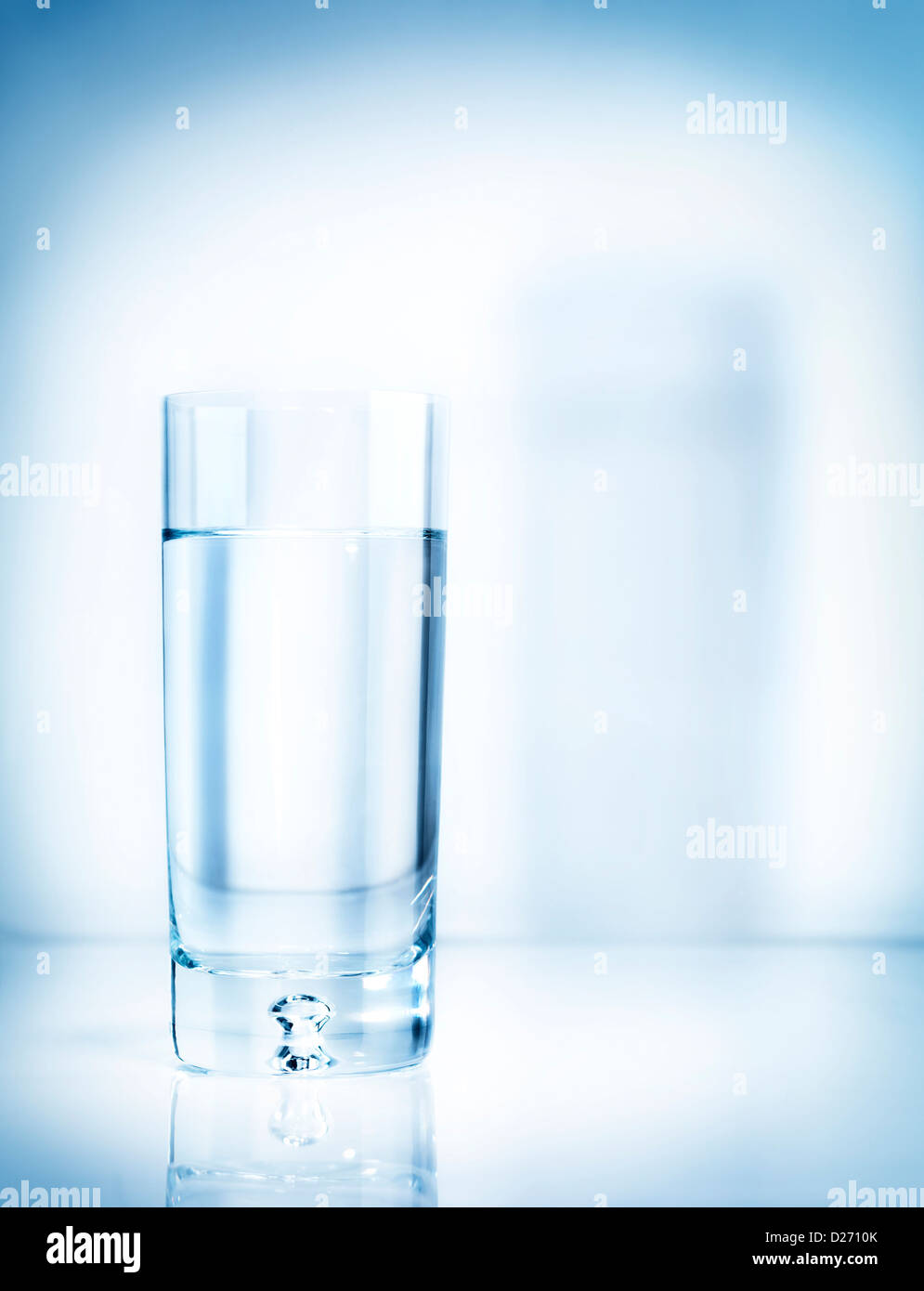 Glass filled with water isolated on light blue background Stock Photo ...