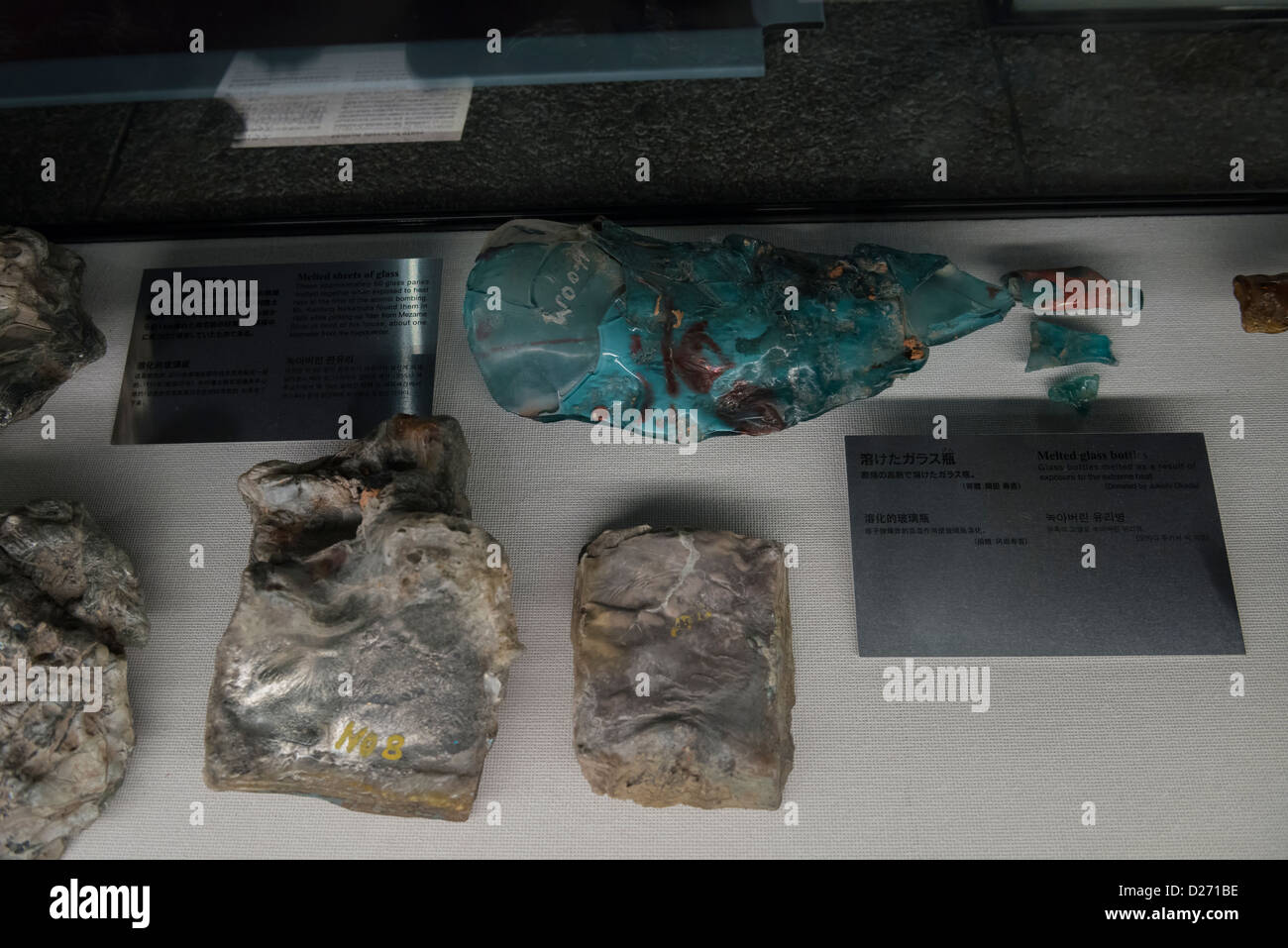 Various Bottles and Glassware Melted by the Heat from The Atomic ...