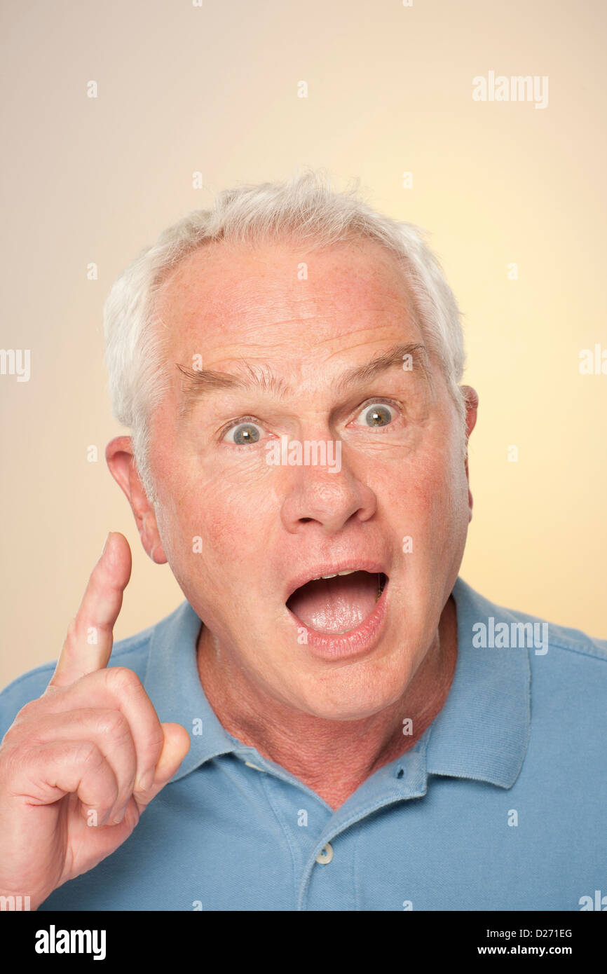 Portrait of senior man pulling funny face Stock Photo - Alamy