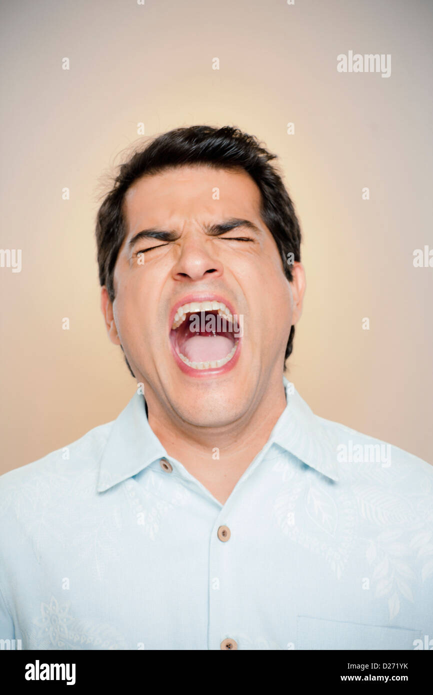 Portrait of man shouting Stock Photo - Alamy