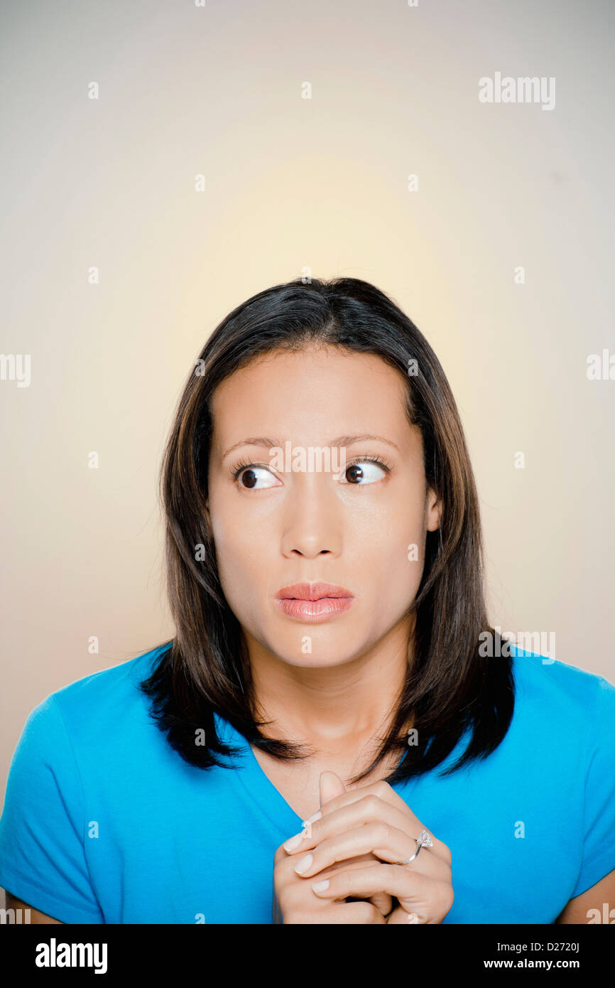 Portrait of uncertain woman Stock Photo - Alamy