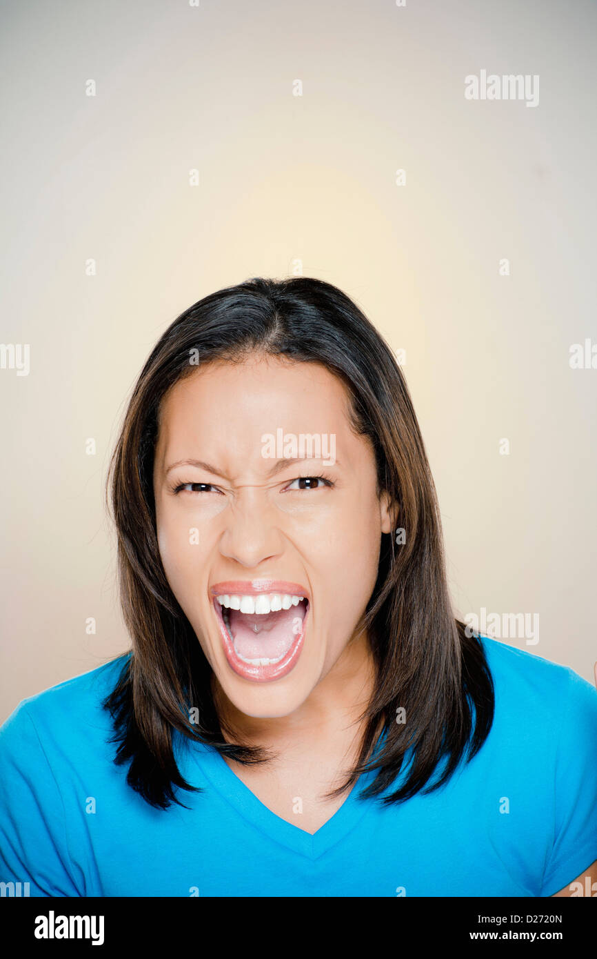 Portrait of woman screaming Stock Photo - Alamy