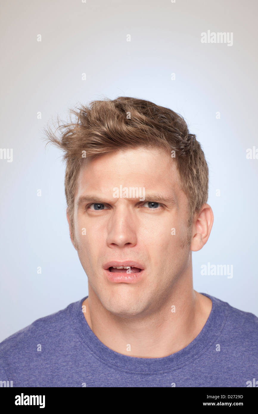 Portrait of displeased man Stock Photo - Alamy
