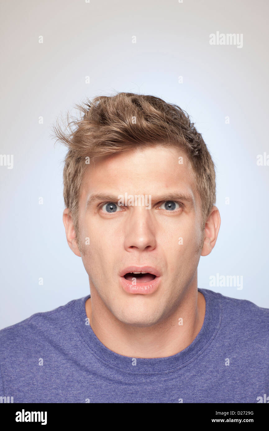 Portrait of man looking surprised Stock Photo - Alamy