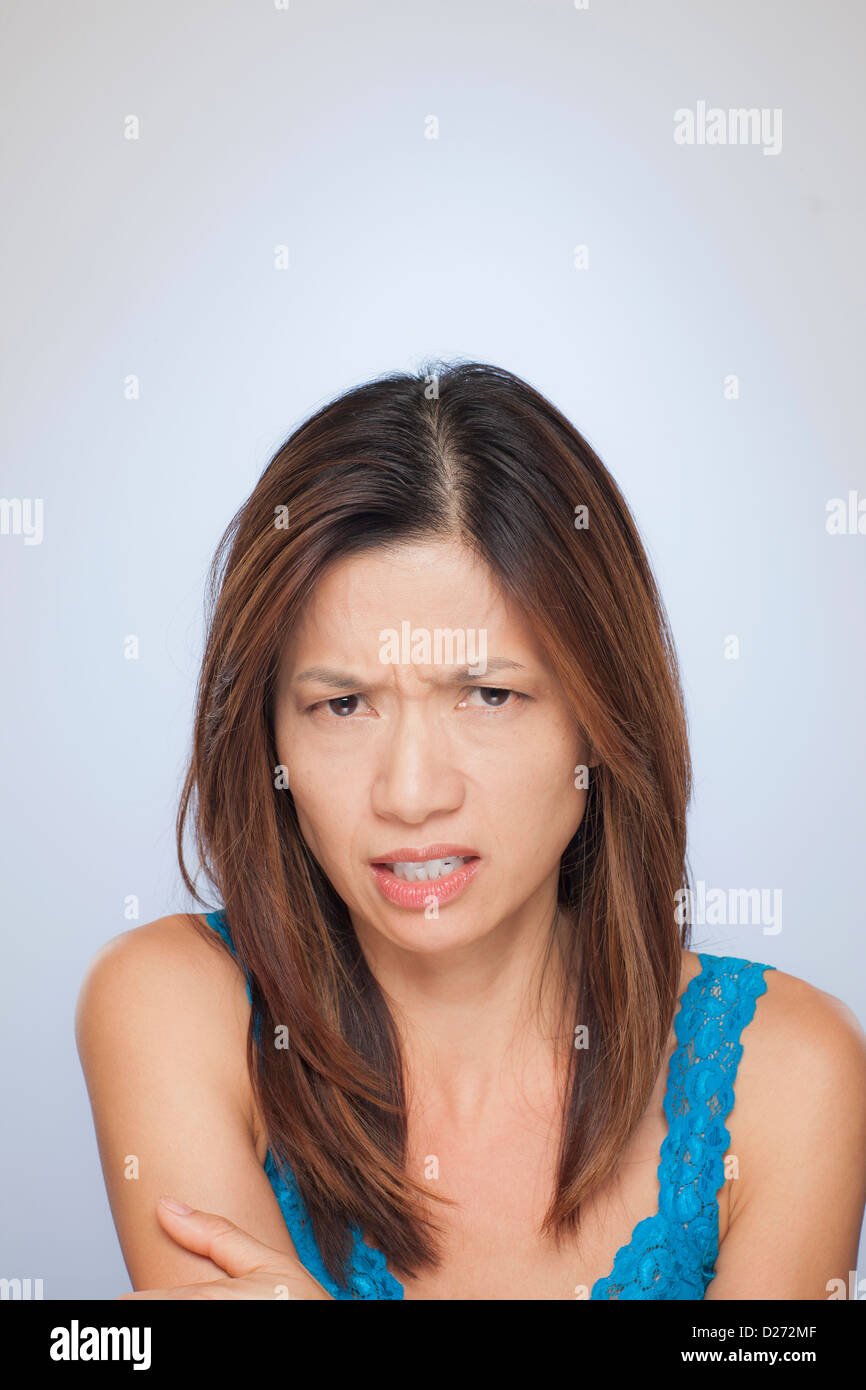 Portrait of woman making face Stock Photo - Alamy