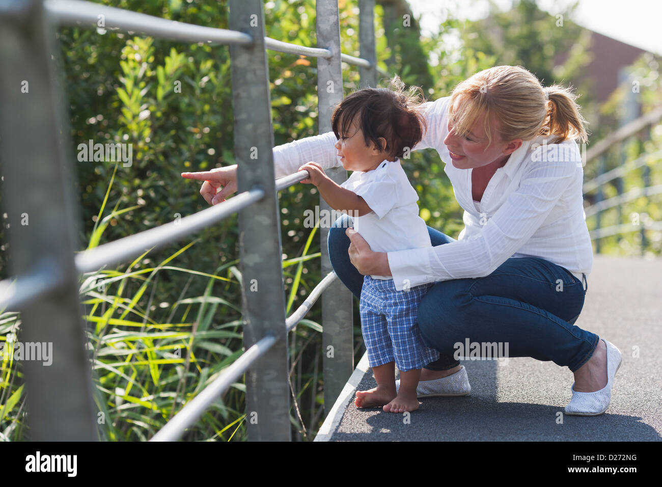 Goirle, Netherlands, Mother showing something to her baby boy Stock ...