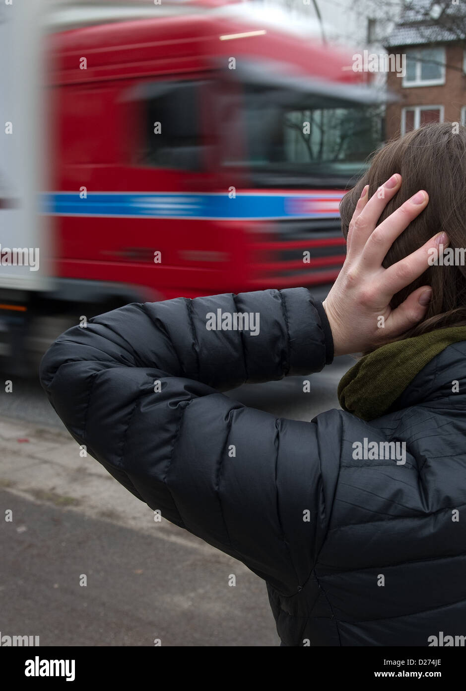 The illustration shows a woman holds her ears as a lorry drives by in ...