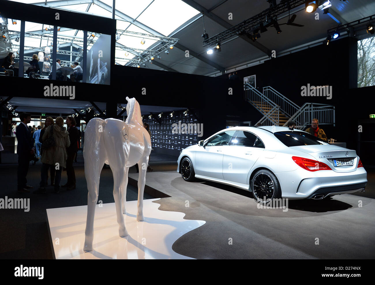 A horse statue and Mercedes CLA 250 sits on display at the Mercedes ...