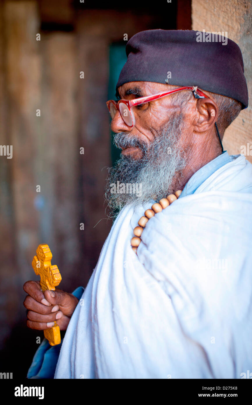 Portrait of an Orthodox Christian priest standing in the doorway at the ...