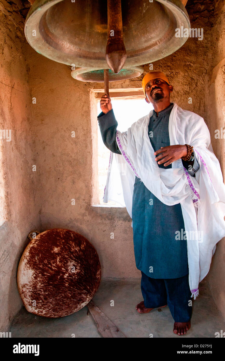 An Orthodox Christian priest in the bell-tower at the cliff-top ...