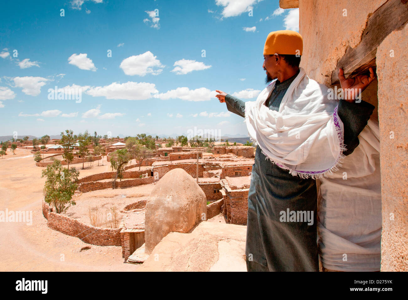 An Orthodox Christian priest in the bell-tower at the cliff-top ...