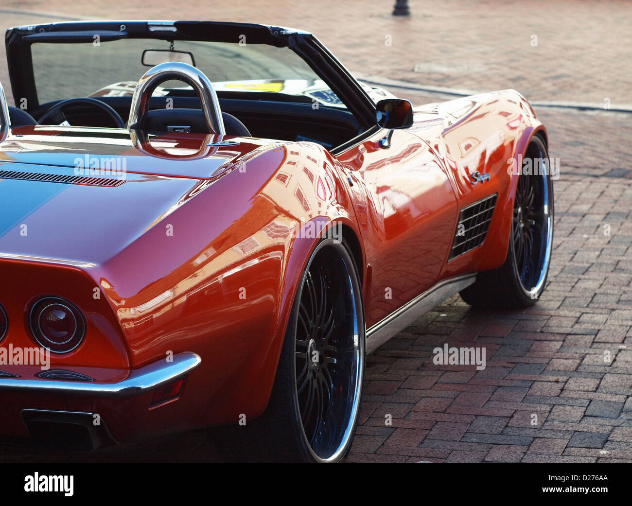 Classic sports car parked on deserted street. Red Stingray model Stock ...