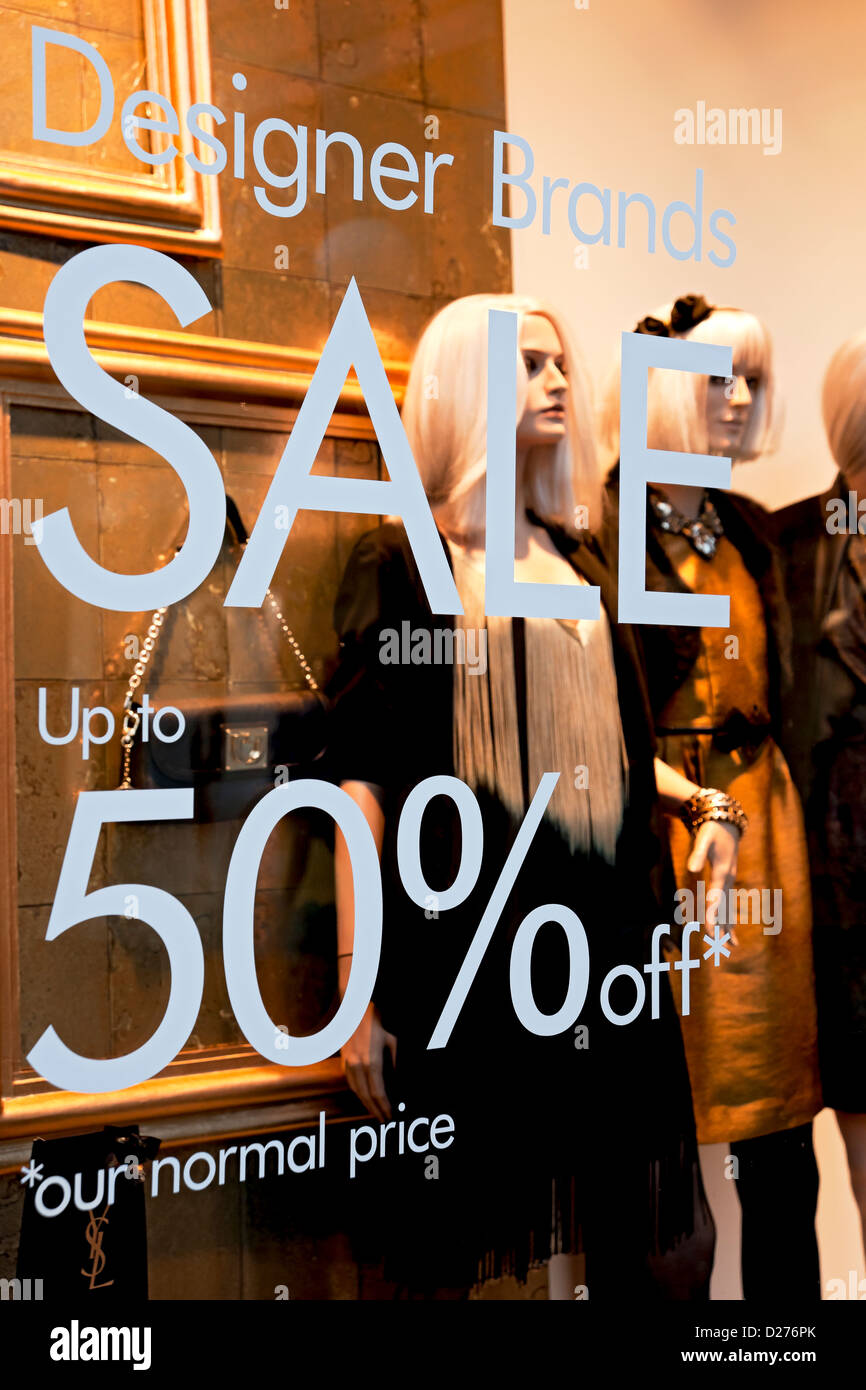 Close up of sale sales signs signage sign on shop store window ...