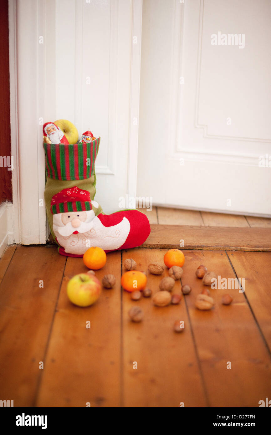 A Nicholas stocking is filled with nuts, fruit and chocolate Stock ...