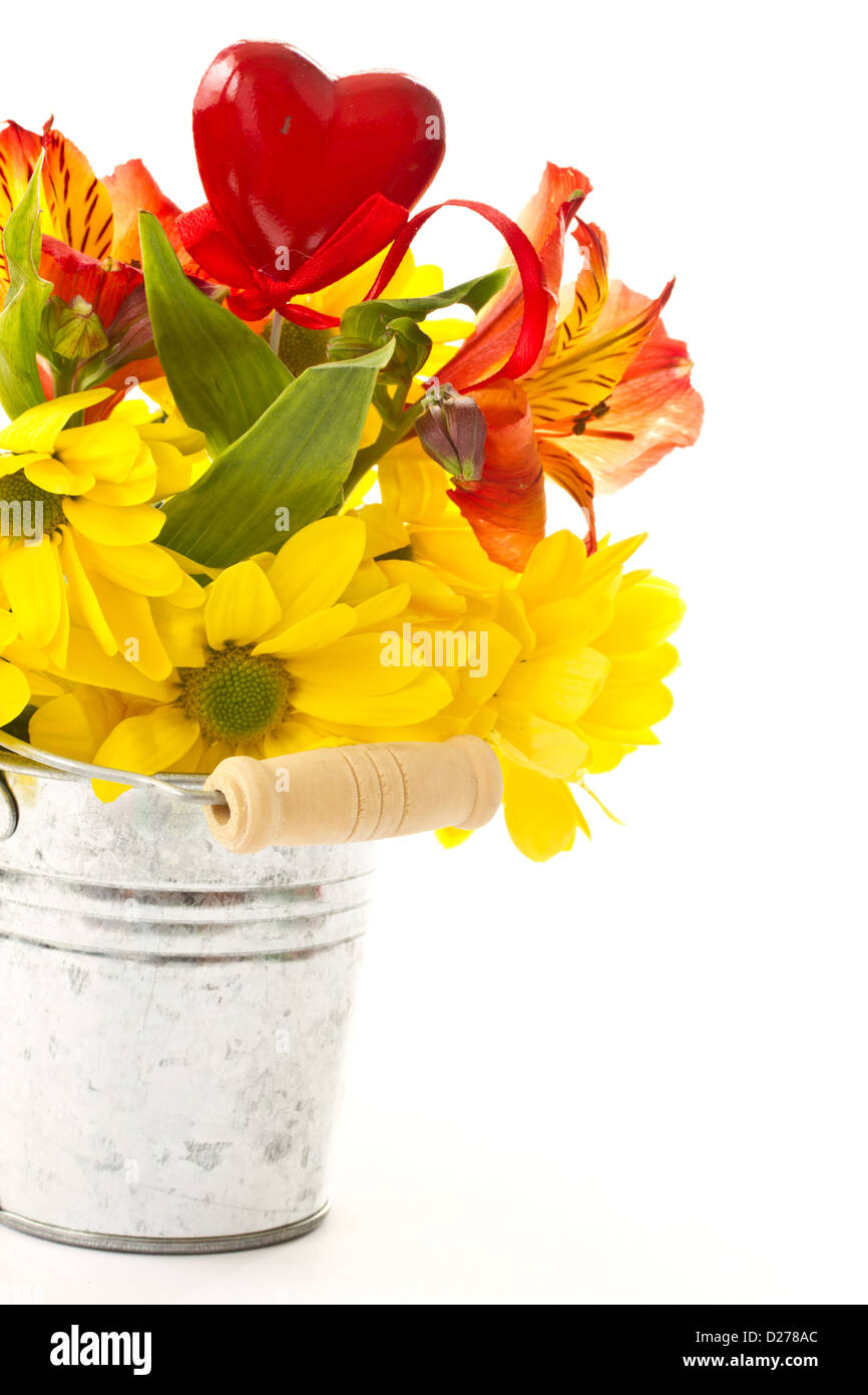 flowers in a bucket Stock Photo - Alamy