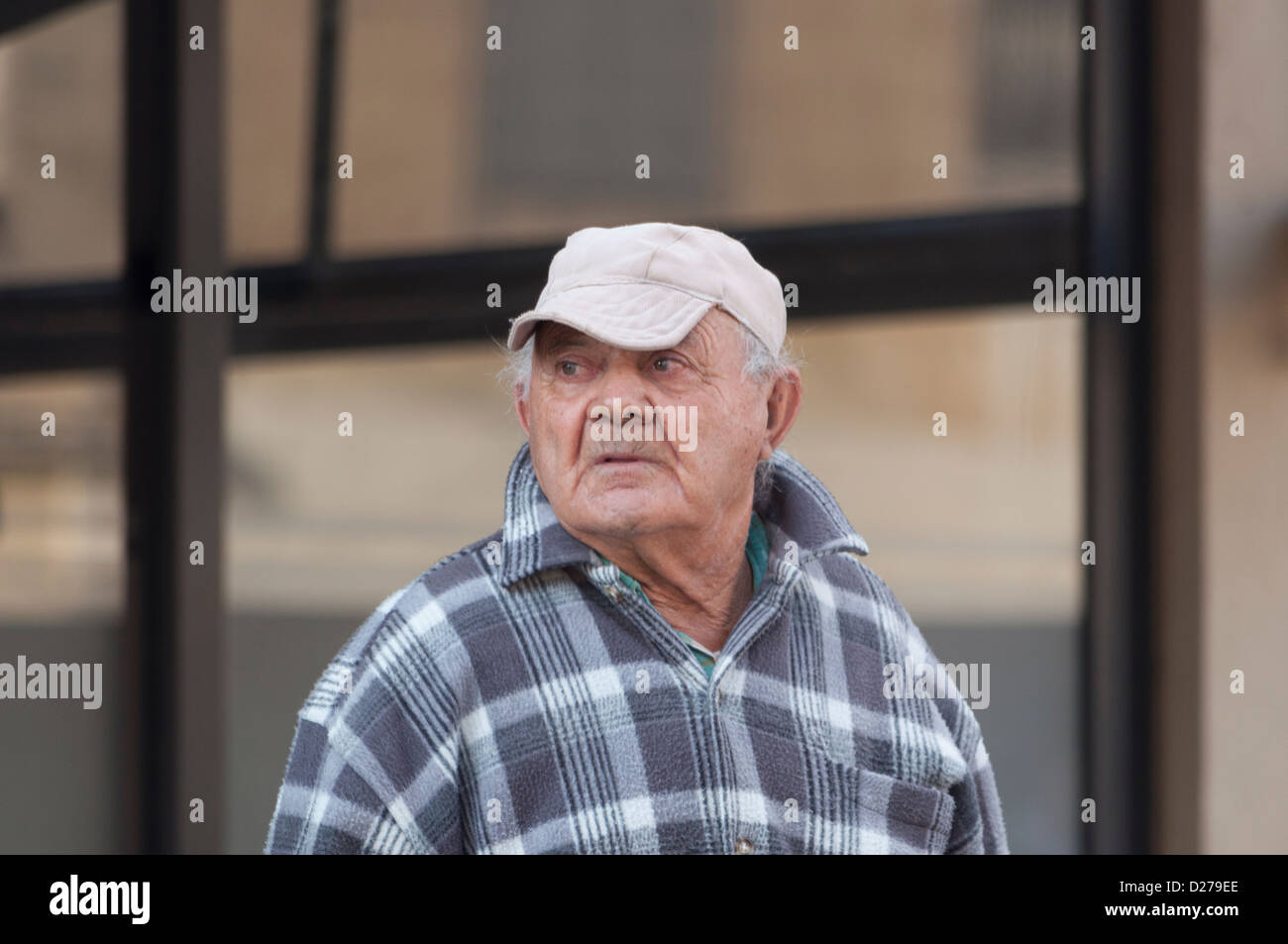 Old man crossing city street Stock Photo - Alamy